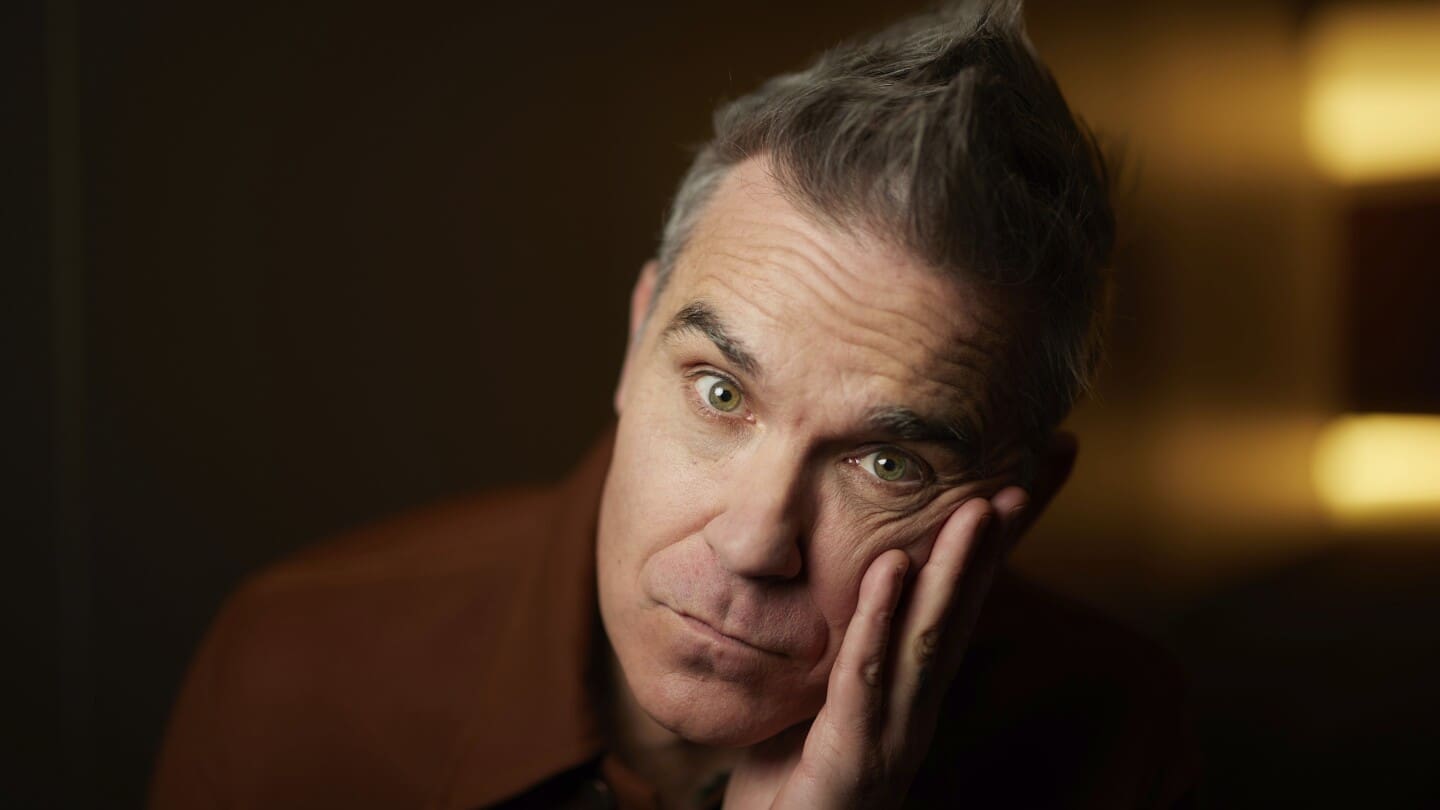 Robbie Williams: The Tale of a Cheeky Monkey Turned Music Legend ...